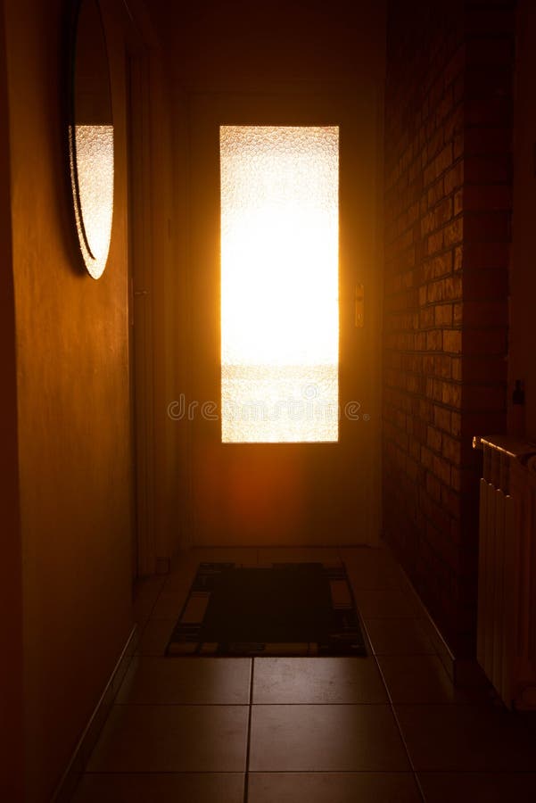 Warm Sunset Light Visible in the Corridor through Old Patterned Doors ...