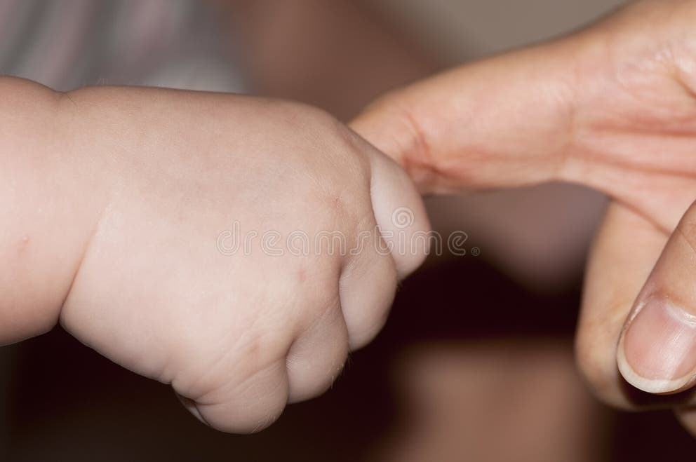 Warm Toddler s Grip stock image. Image of reflect, innocent - 13110093