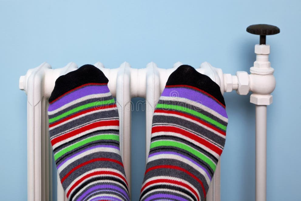 Warming Feet on the Radiator Stock Image - Image of lifestyle, foot ...