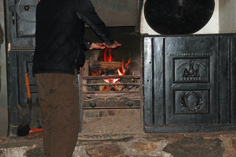 Warming Hands on an Old Fashioned Log Fire Stock Photo - Image of ...