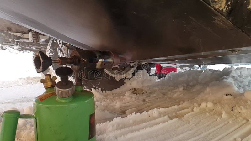 Warming Up Engine Fire Blowtorch. Engine Heating by Fire. Extreme Cold ...