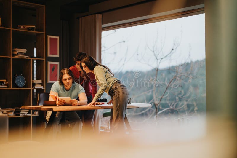 Three Friends Collaborating on a Project at a Cozy Home with a View ...