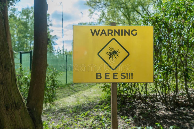 Warning Bees - Yellow Sign Featuring a Bee in Front of the Beehive ...