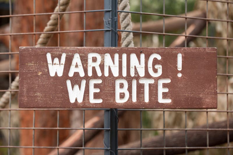 Warning we Bite stock photo. Image of safety, risk, text - 32393140
