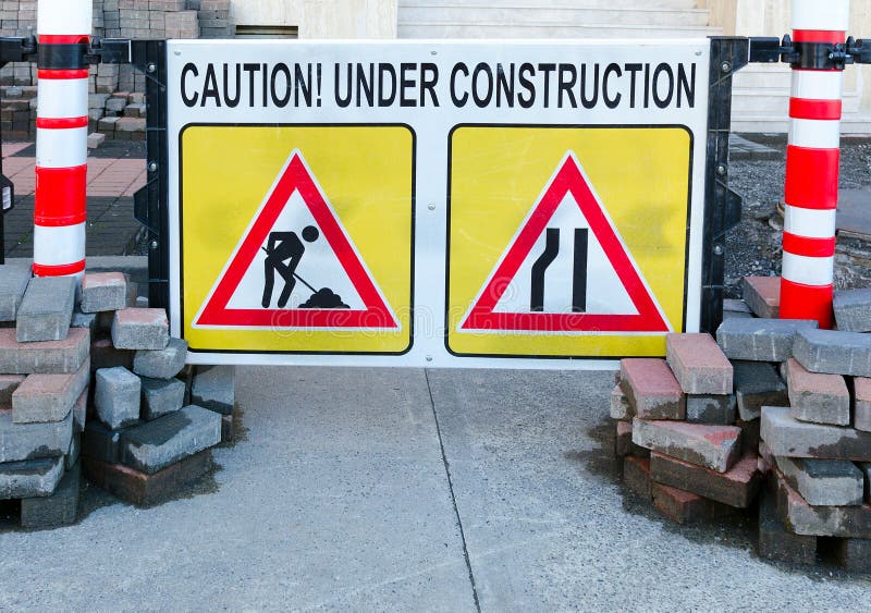 Warning Board with the Inscriptions Caution, Under Construction at the ...