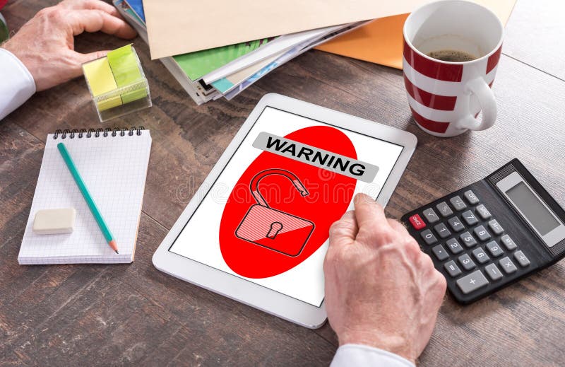 Warning Concept on a Tablet Stock Photo - Image of padlock, hand: 306237272