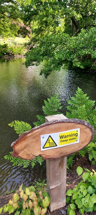 Warning Deep Warning Sign beside Pond. Stock Image - Image of deep ...