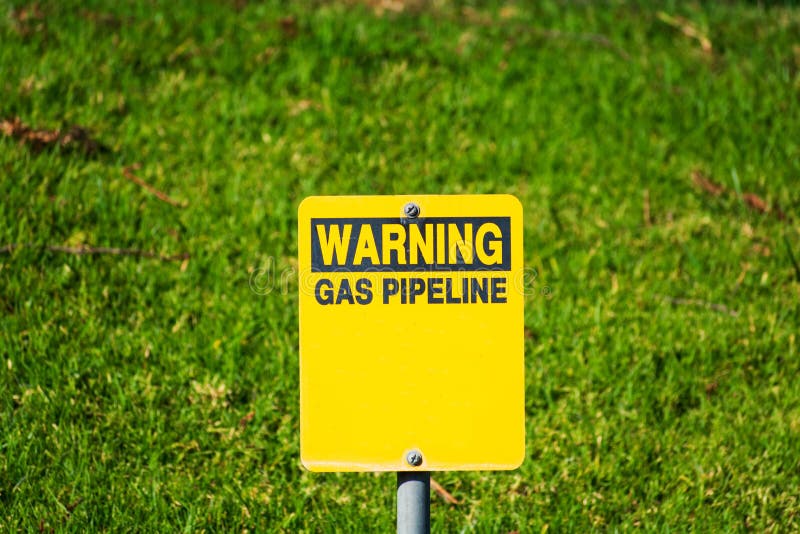 Warning Gas Pipeline Sign with Blurred Background of Green Landscape ...