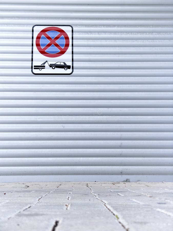 Warning Parking Sign on the Garage Door Stock Image - Image of door ...