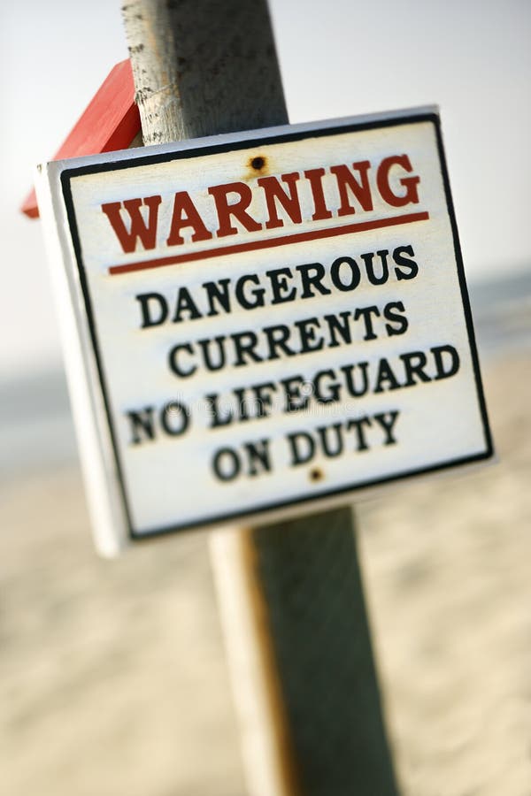 Yellow Damage Warning Sign in Front of Storm Damaged Roof of House ...