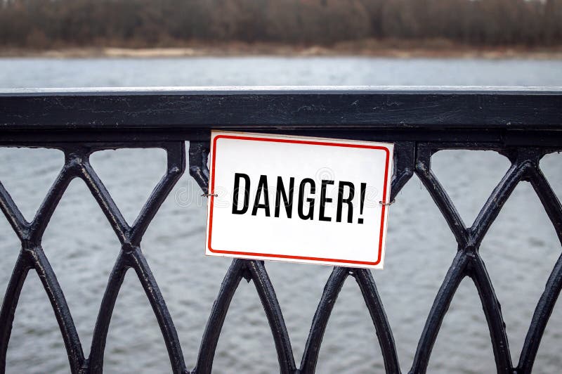 Warning Sign Danger on the Fence Near the River Stock Photo - Image of ...