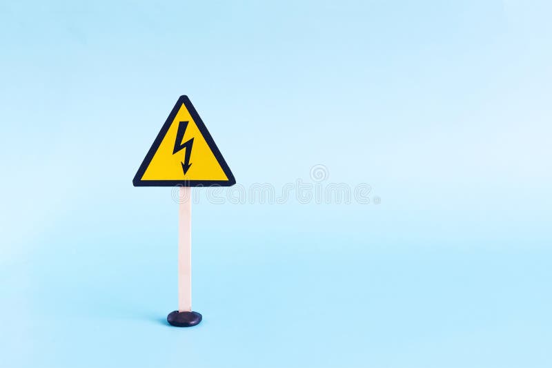 Warning Sign Electrical Danger in a Yellow Triangle on a Light ...