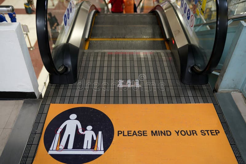 Warning Sign on the Escalator for Safety Stock Photo - Image of safety ...