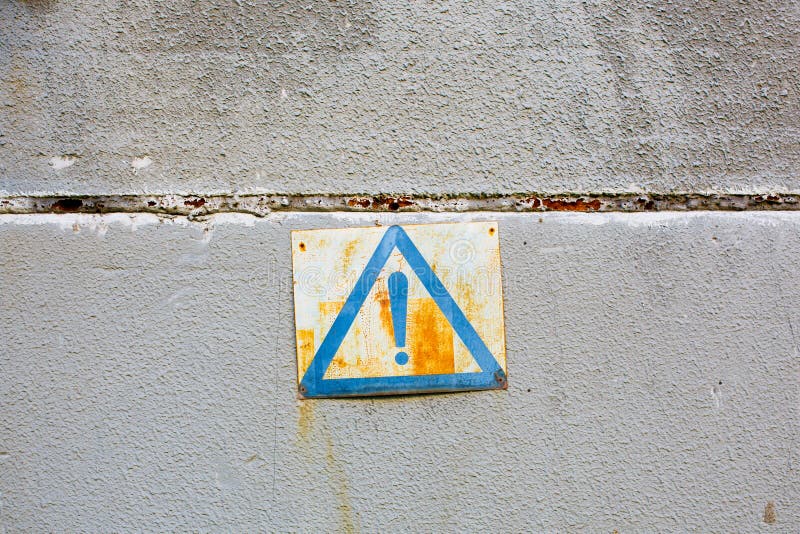 Warning Sign on a Gray Wall Stock Photo - Image of inside, rust: 40812552