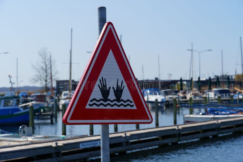 Warning Sign on a Harbor in a Triangular Shape with a Red Border Stock ...