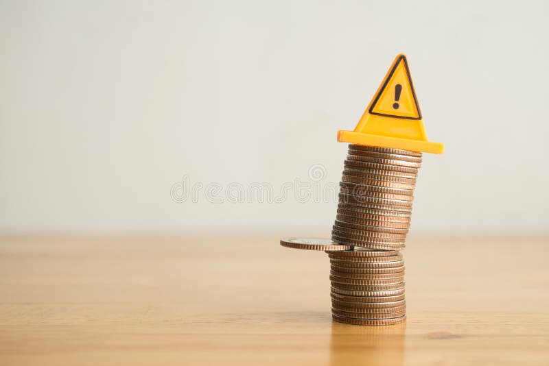 Warning Sign Label on Stack Coins in Uncertainty Situation on Wooden ...