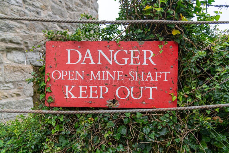 A Warning Sign for an Open Mine Shaft at a Cornish Tin Mine Stock Photo ...