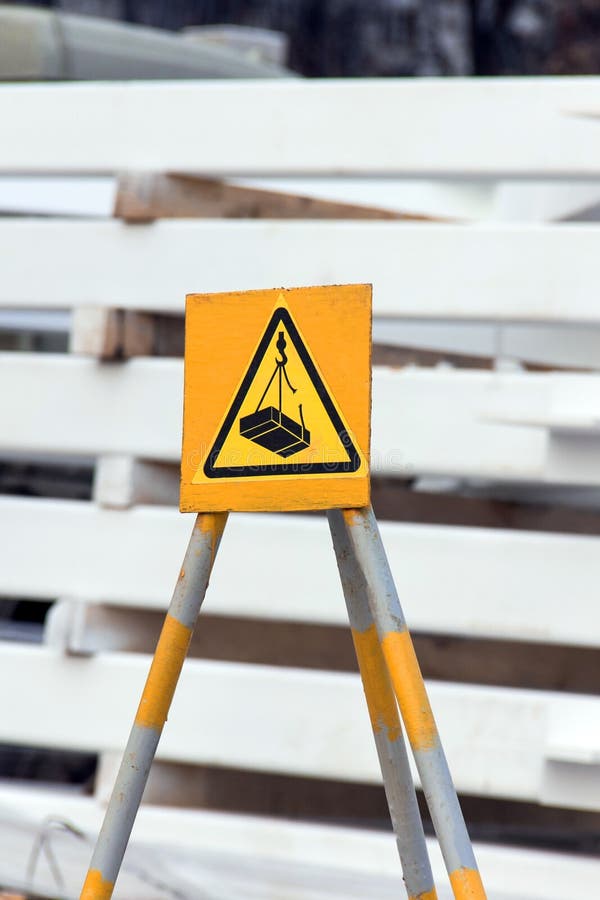 Warning Sign of a Possible Drop in Cargo from a Crane on a Yellow ...