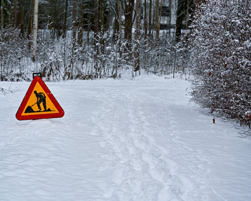 Warning Sign for Road Work Standing in Snow Stock Image - Image of ...