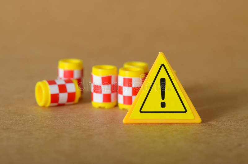 Warning Sign with Scattered Hazard Cylinders on Ground â€ Safety Alert ...