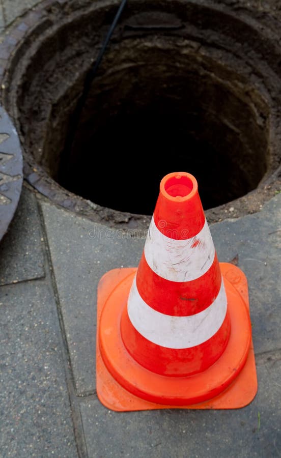 Warning Sign and Sewerage Hole Stock Image - Image of glaring ...