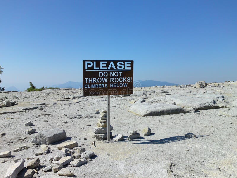 Warning Sign Surrounded by Rocks. Stock Image - Image of sign, scenic ...