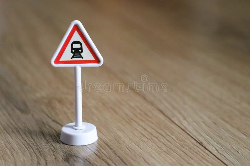 Warning Sign for Train Crossing Placed on Wooden Floor for Visibility ...