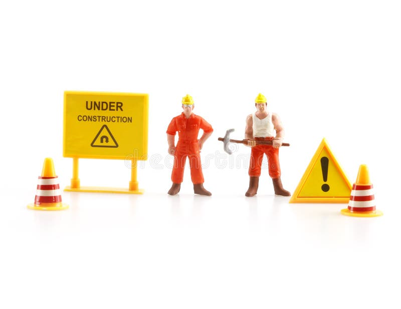 Warning Sign Under Construction with Miniature Figure Labo Stock Photo ...