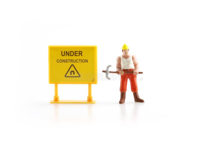 Warning Sign Under Construction with Miniature Figure Labo Stock Image ...