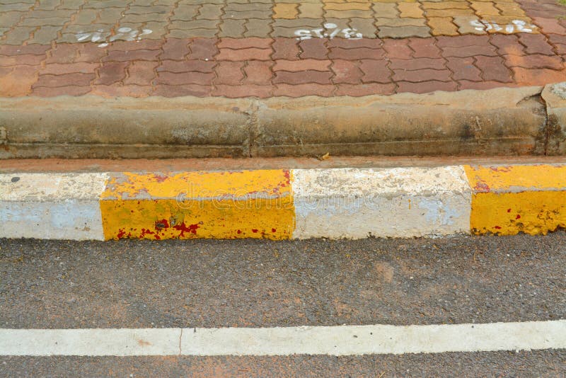 Warning Sign of White and Yellow Color on Road Stock Image - Image of ...