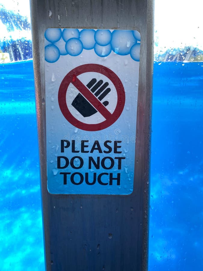 A Warning Sticker on a Post that Says Please Do Not Touch Stock Photo ...