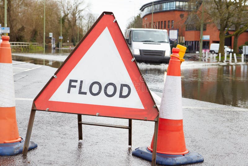 Warning Traffic Sign on Flooded Road with Fire Engine Stock Photo ...