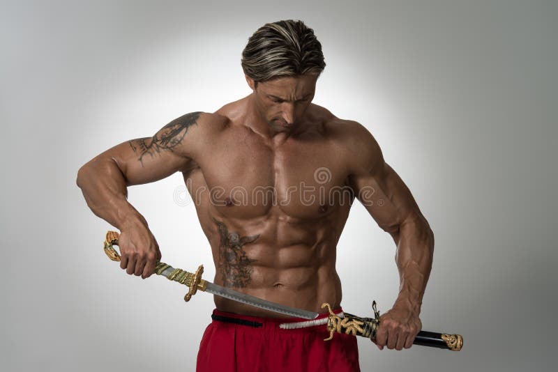 Warrior with Short Sword Over Grey Background Stock Photo - Image of ...