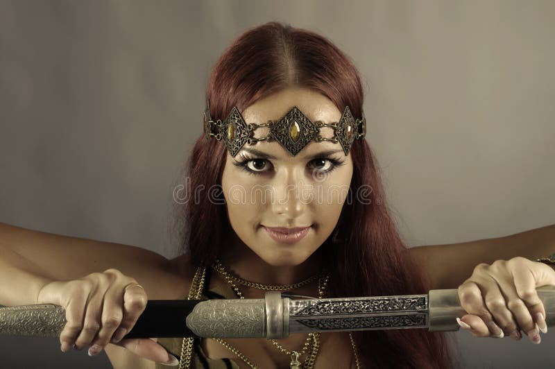 Warrior Woman Holding Sword in Her Hand Stock Photo - Image of fight ...
