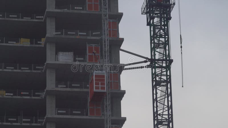 Construction Elevator Goes Up during Construction of Multi-storey ...