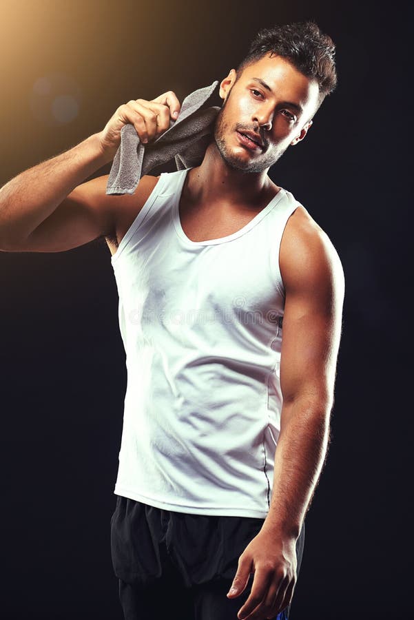 That Was a Killer Workout. Studio Shot of a Fit Young Man Isolated on ...