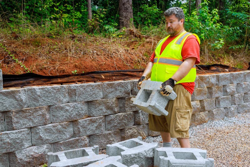 When Developing New Property Construction Worker Uses Cement Blocks To ...