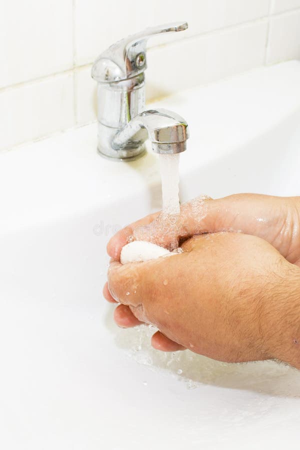 Wash Basin and Running Water from the Tap in Bathroom Stock Photo ...