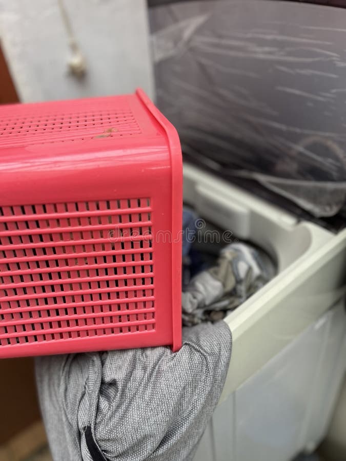 Wash Clothes in the Washing Machine Then Dry the Clothes in a Row on ...