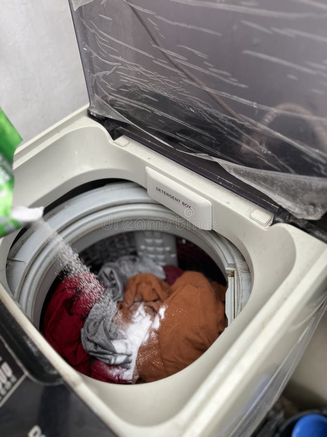 Wash Clothes in the Washing Machine Then Dry the Clothes in a Row on ...