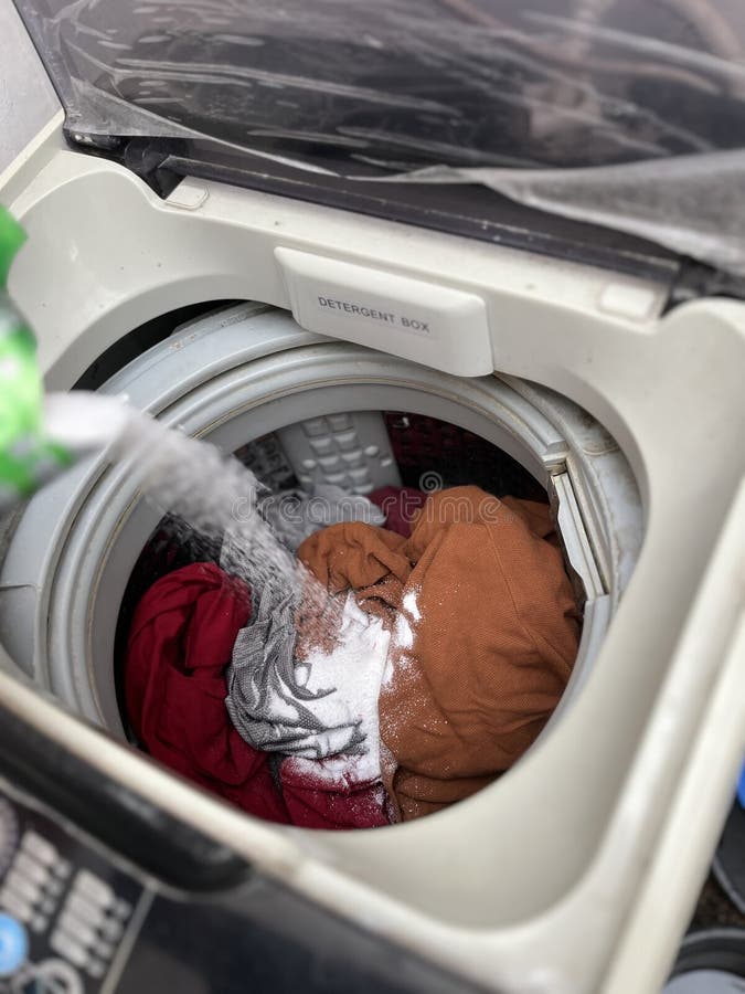Wash Clothes in the Washing Machine Then Dry the Clothes in a Row on ...