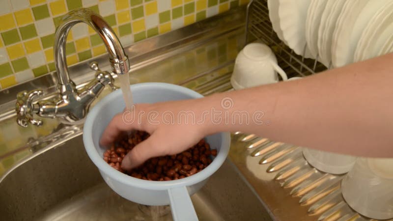 Wash the Nuts in the Colander in the Kitchen. Stock Footage - Video of ...