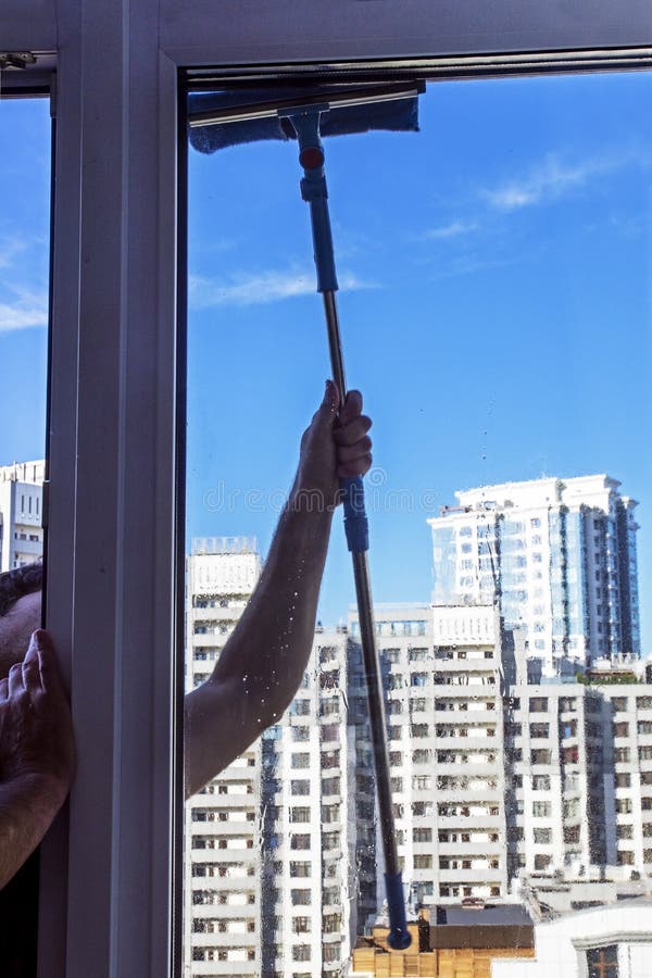Wash Panoramic Windows Against the Blue Sky, Cleaning Company Stock ...
