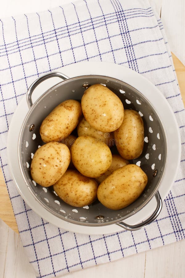 Washed and Wet Potatoes in a Colander Stock Photo - Image of food ...