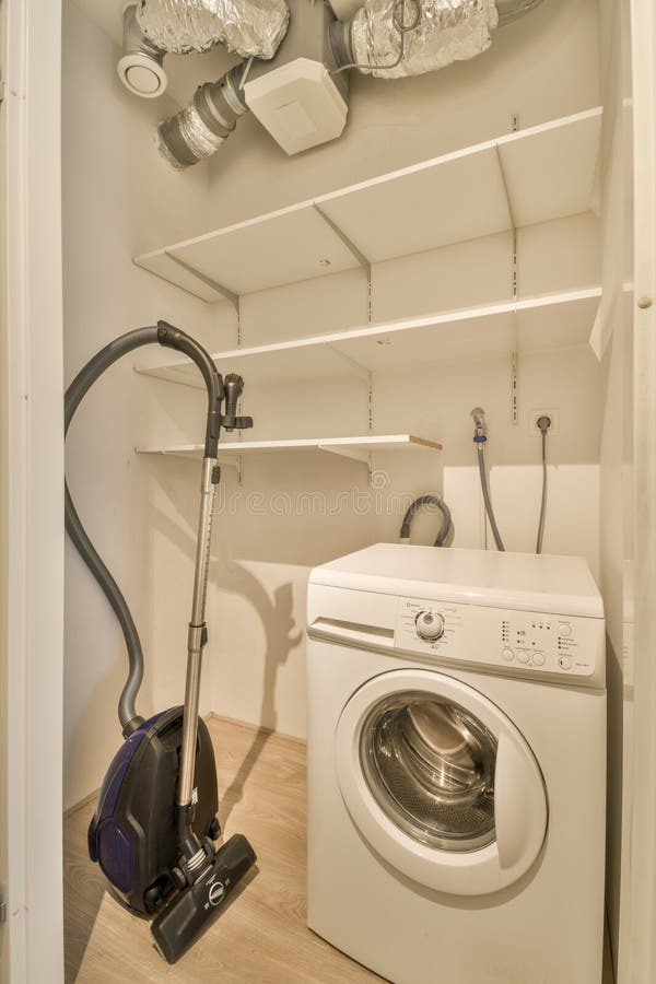 A Laundry Room with a Washing Machine and a Window Stock Photo - Image ...