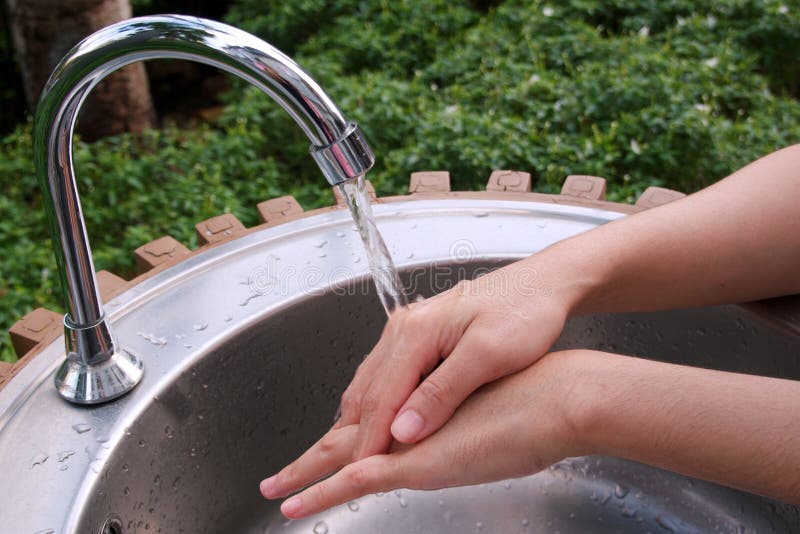 Washing Back Hand by Clean and Clear Water that Flows from the Tap at ...