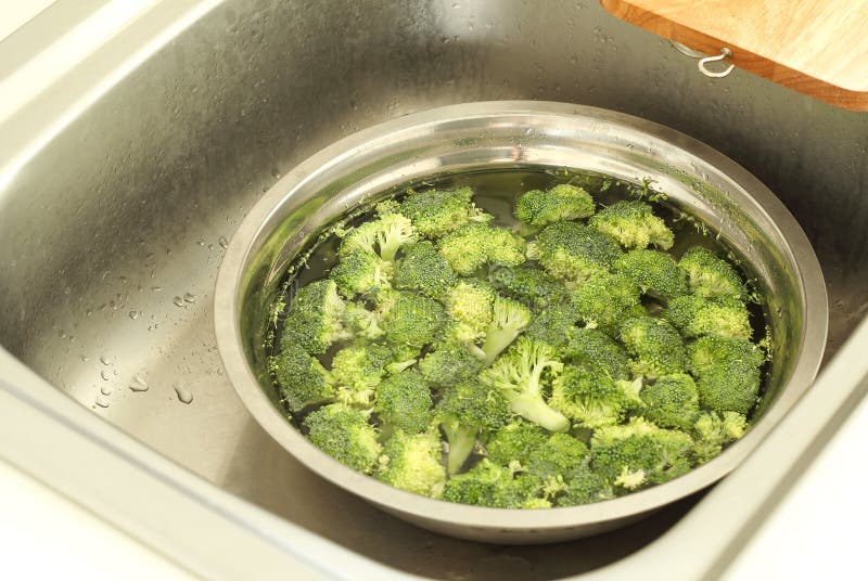 Washing Broccoli in the Kitchen Sink Stock Image - Image of clean, leaf ...