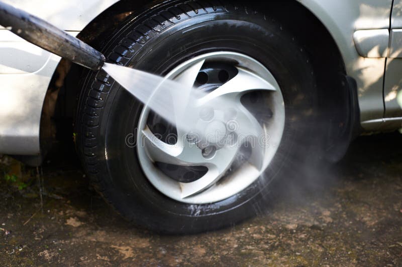 Washing car wheels stock image. Image of cleaning, hose - 27134191