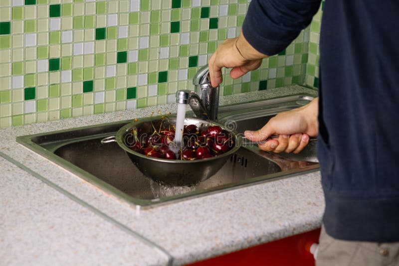 Washing cherries stock photo. Image of healthy, sink - 120037516