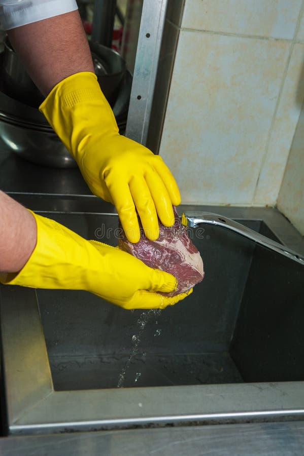 Washing and cleaning meat stock image. Image of business - 76244641